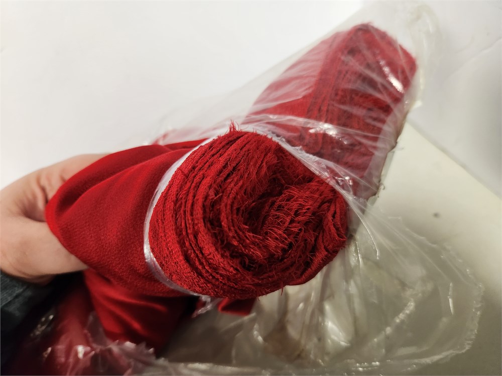 Rust Belt Revival Online Auctions - Roll Of Red Fabric